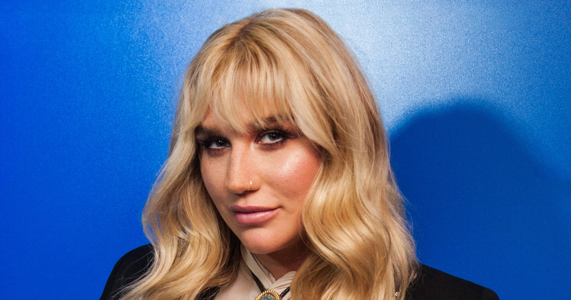 Kesha Tattoos - Narwhal Finger, Smiley Face Ink